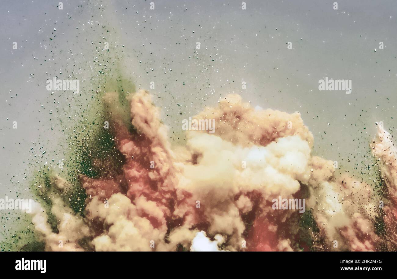 Dust storm and rock particle after detonator blast on the construction ...