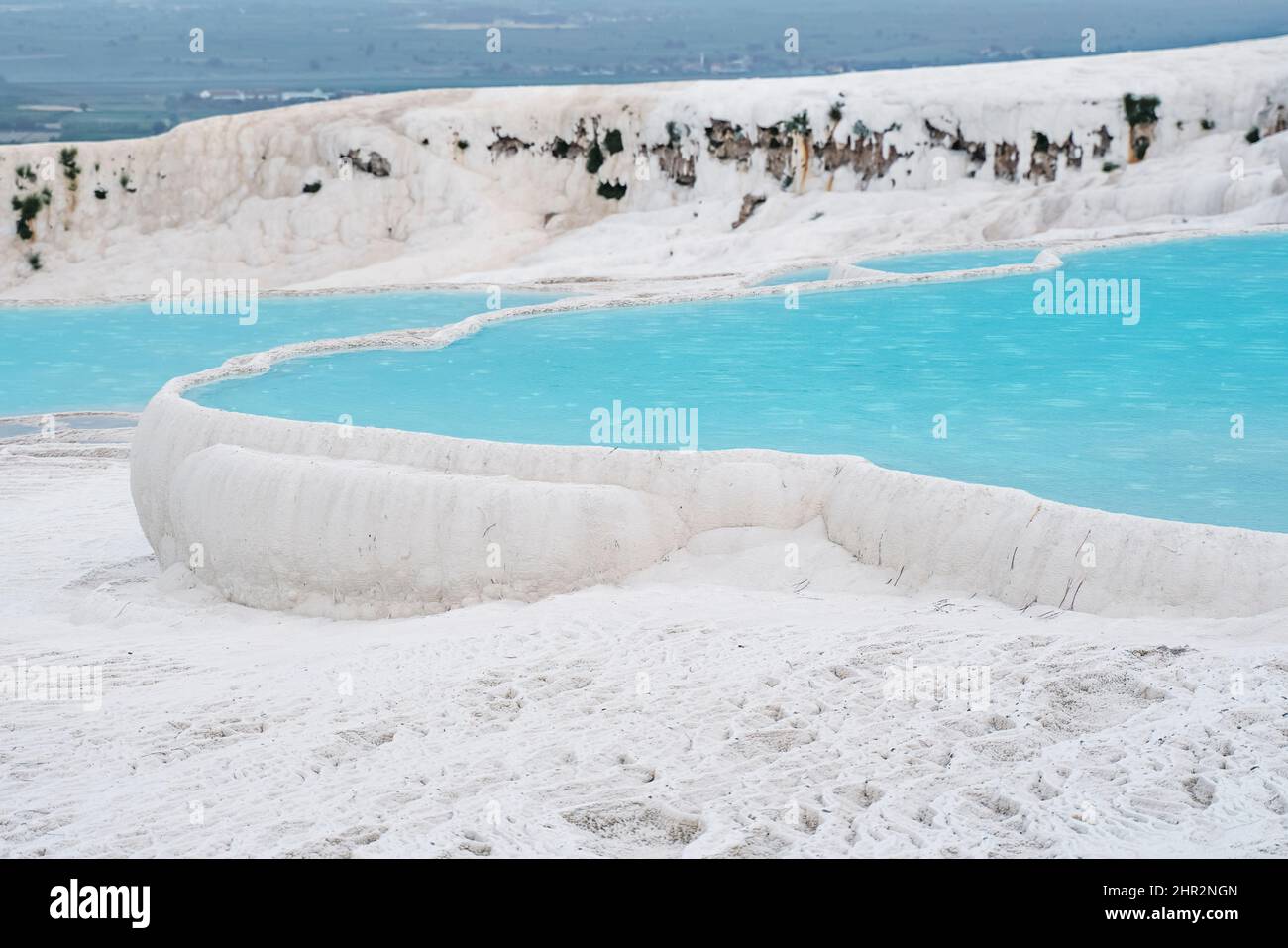 Natural travertine pools and terraces in Pamukkale. Cotton castle in ...