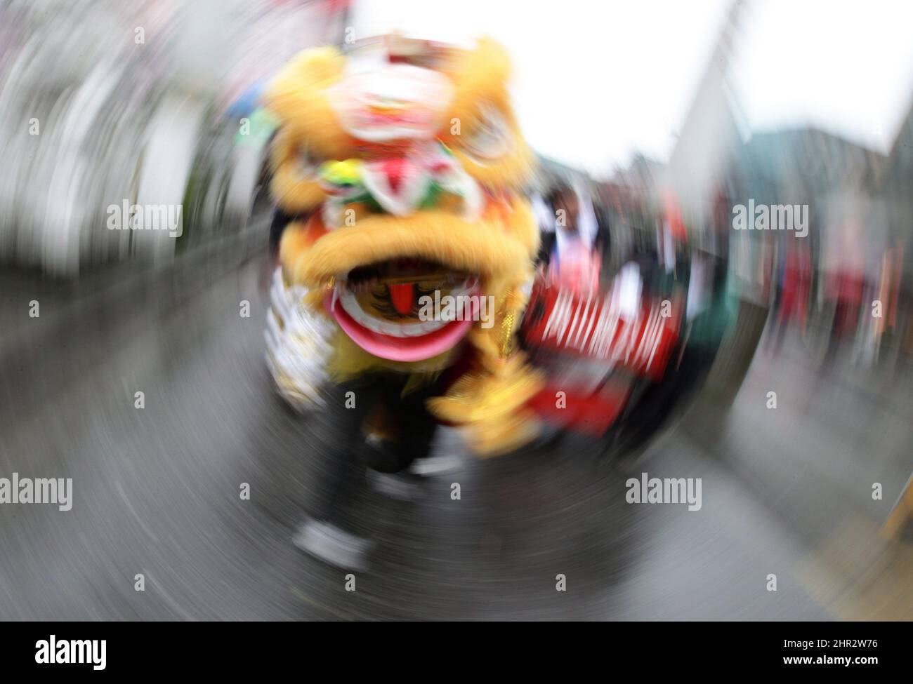 A man performs a lion dance during the Chinese New Year parade in ...