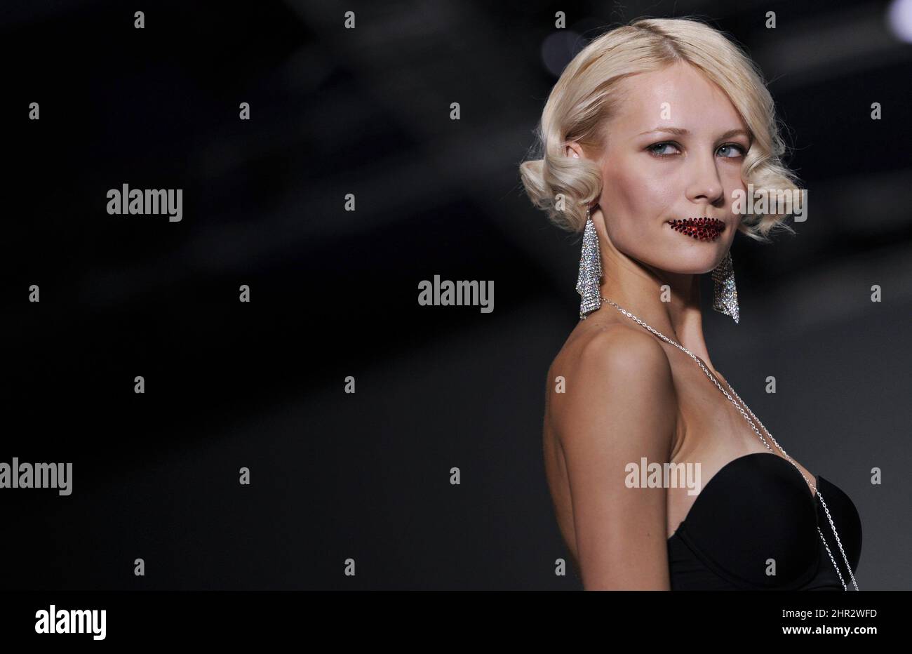 A model wears a design by Micalla during Montreal Fashion Week, in ...