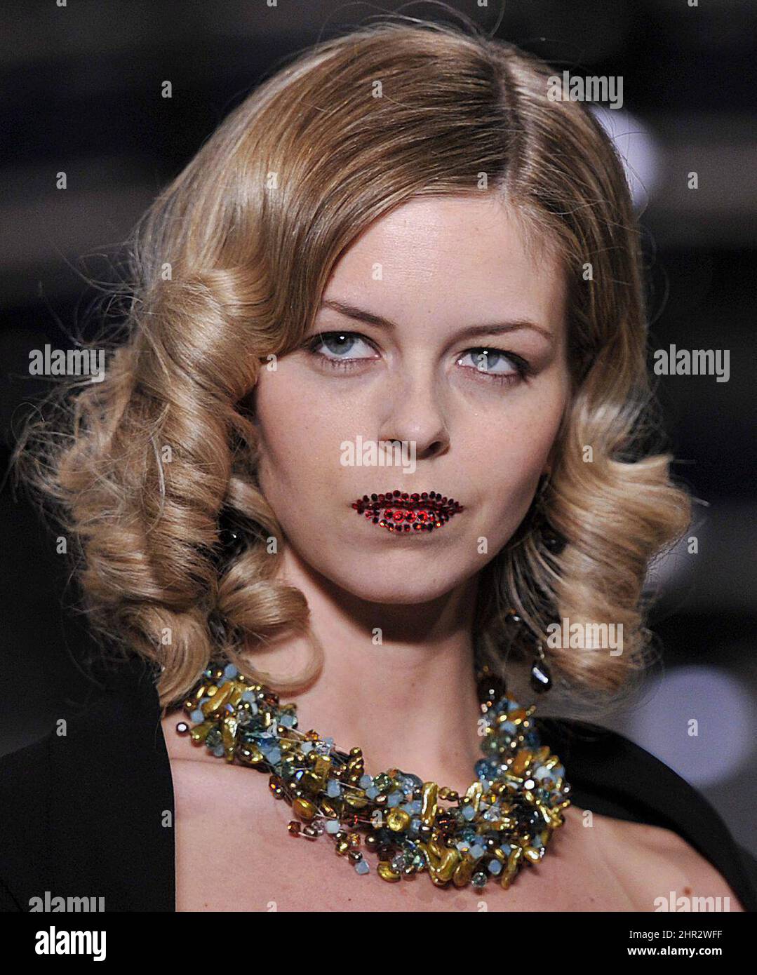 A model wears a design by Micalla during Montreal Fashion Week, in ...