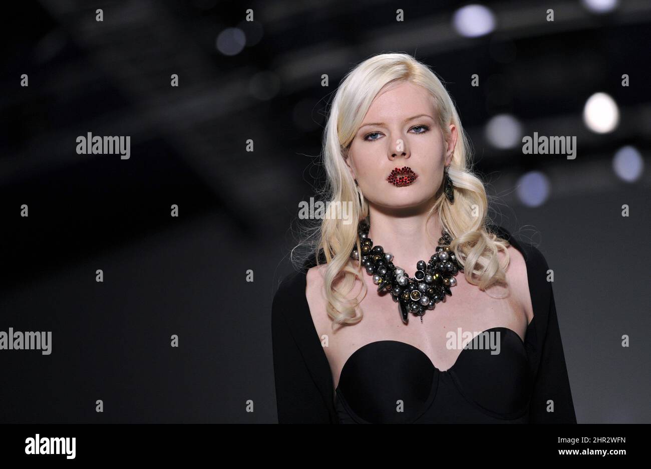 A model wears a design by Micalla during Montreal Fashion Week, in ...