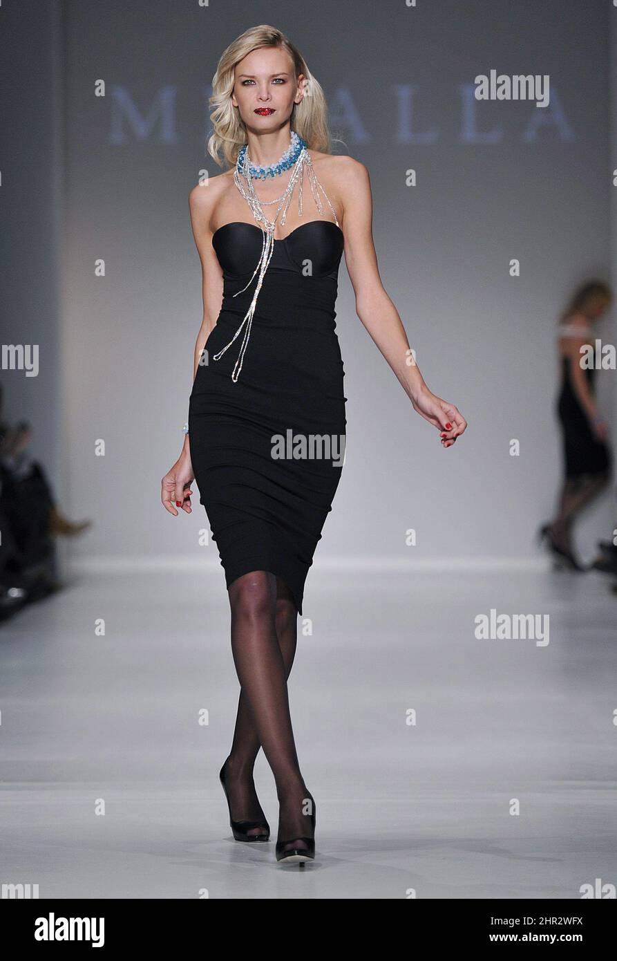 A model wears a design by Micalla during Montreal Fashion Week, in ...