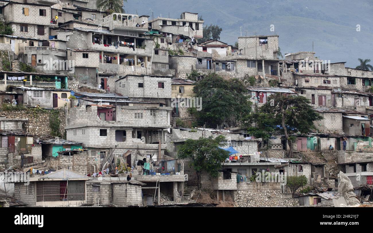 Buildings are partially rebuilt on a hillside in Port-au-Prince ...