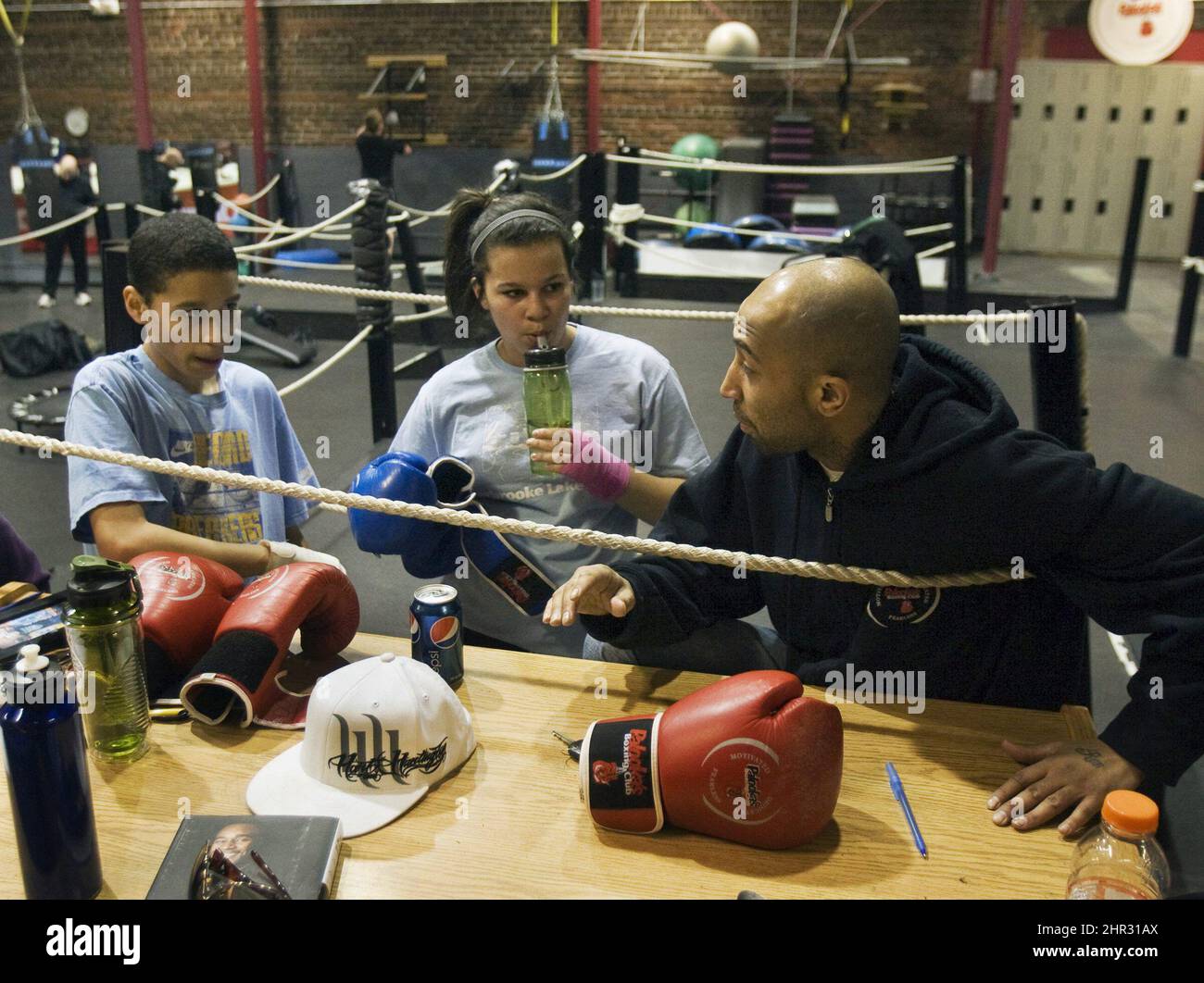 Shyraya Sullivan and her brother Tyree, left, talk with coach Tyson ...