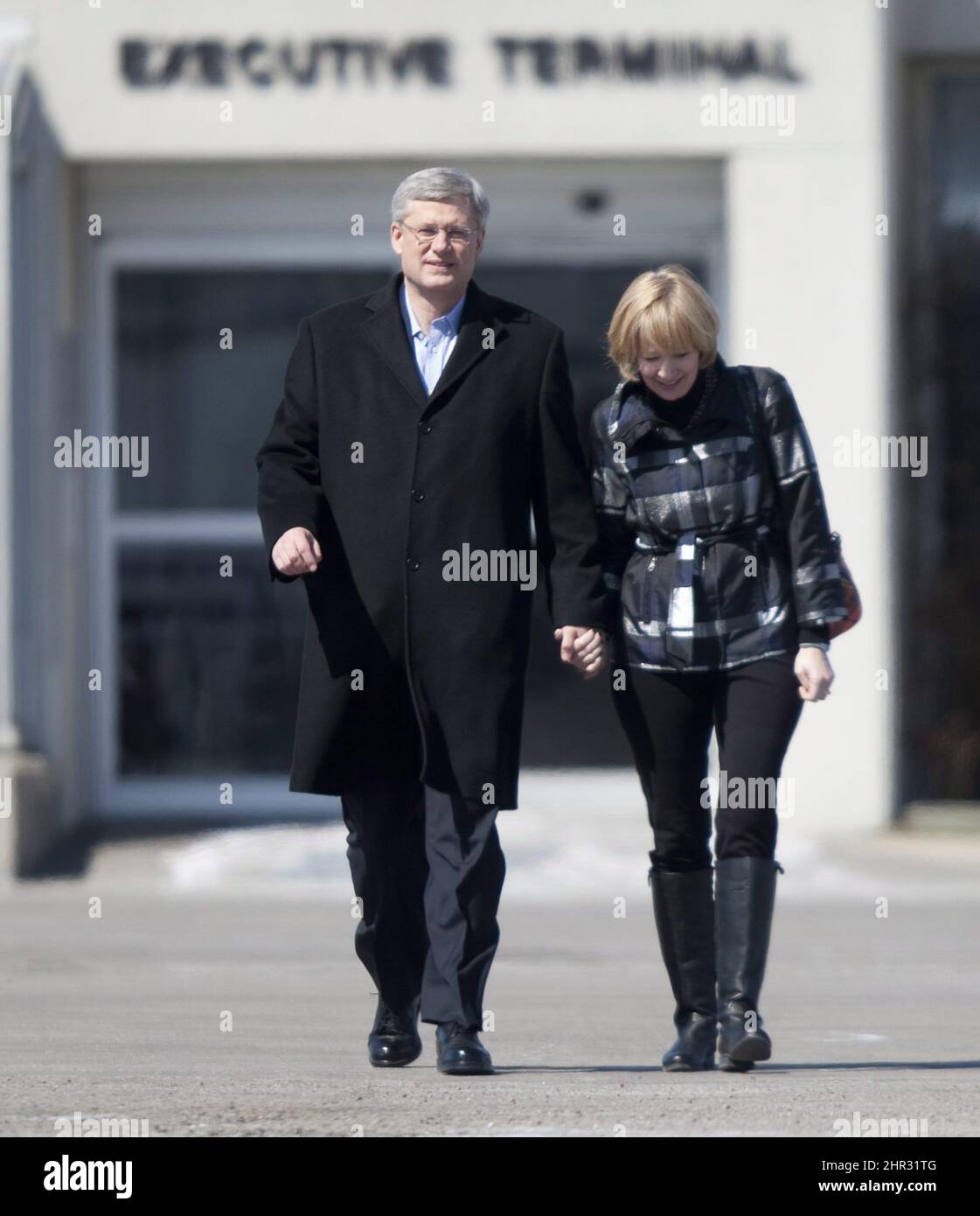 Prime Minister Stephen Harper and his wife Laureen walk to the campain ...