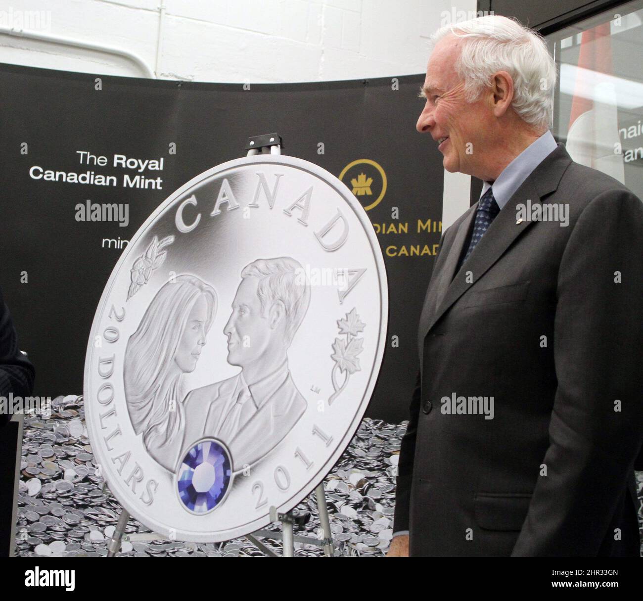 Governor General David Johnston stands next to a rendition of a new ...