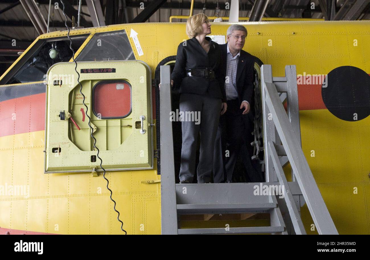 Prime Minister Stephen Harper and Laureen Harper emerge from a Canadair ...