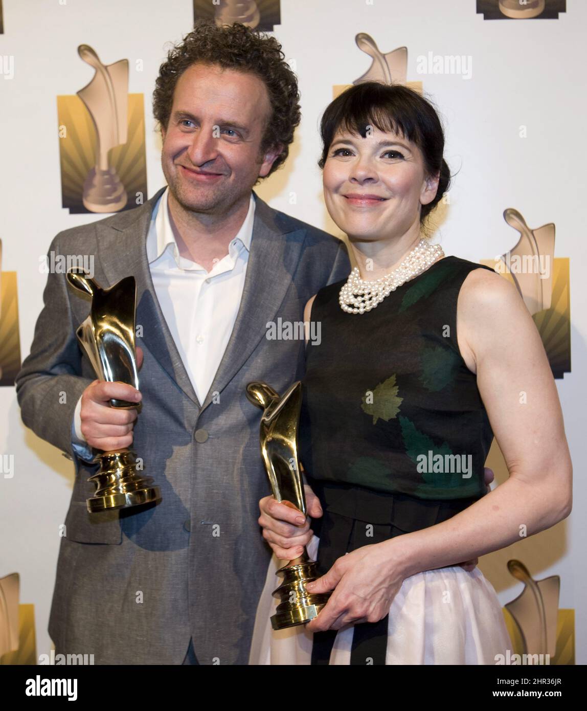 Anne Dorval and Daniel Briere hold up their trophies for best actor and ...
