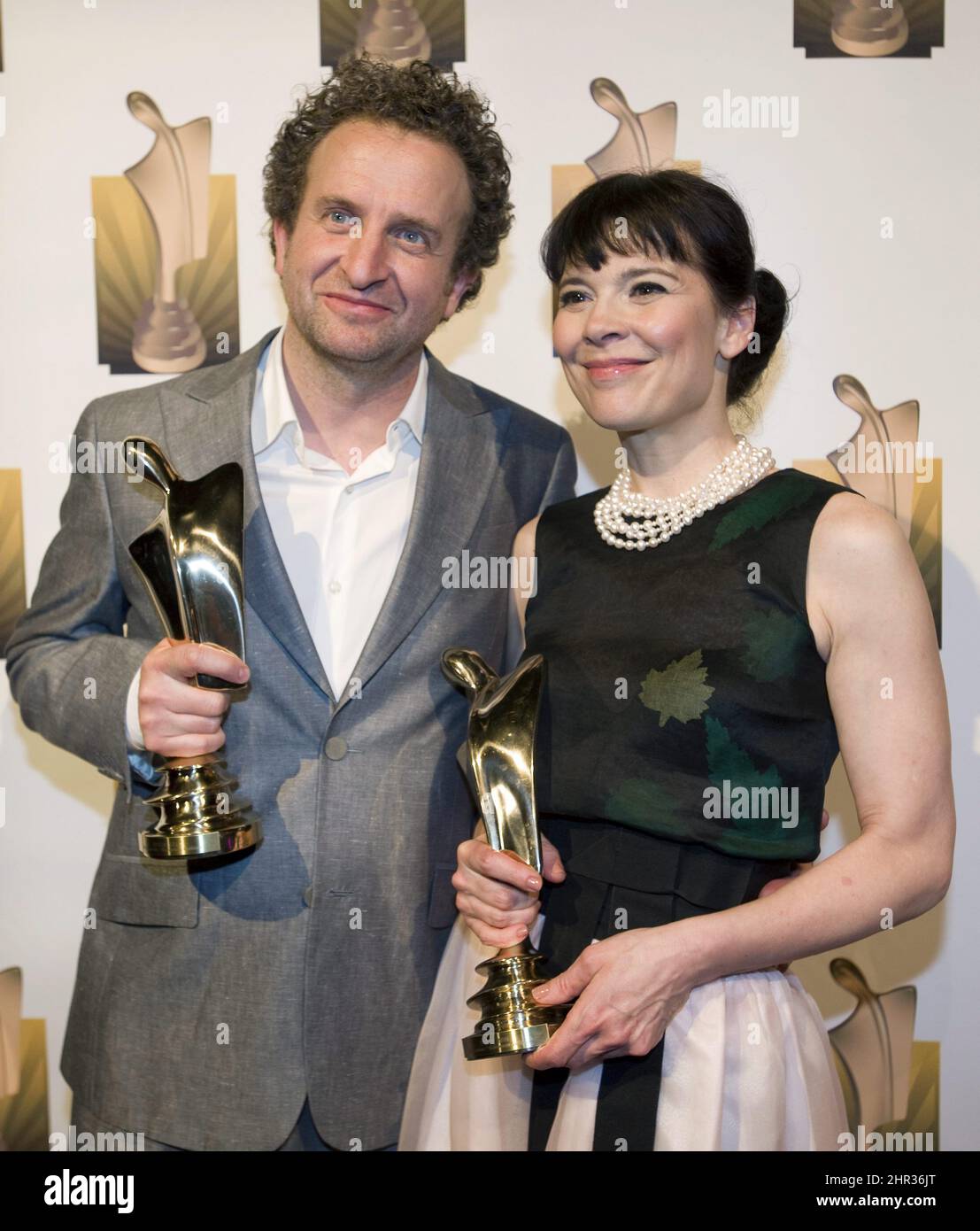 Anne Dorval and Daniel Briere hold up their trophies for best actor and ...