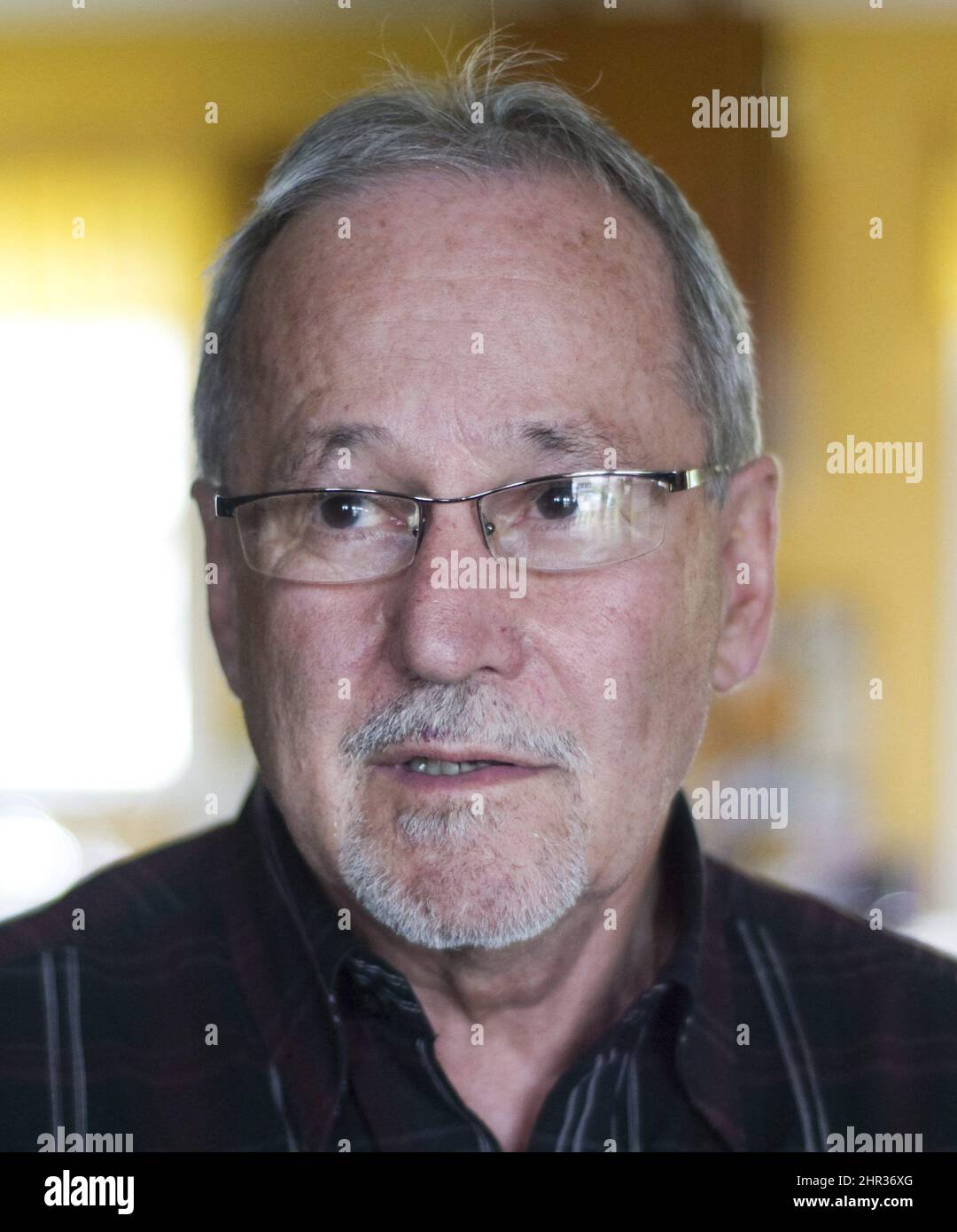 Rene Young speaks to reporters at his home in Trois-Rivieres, Que ...
