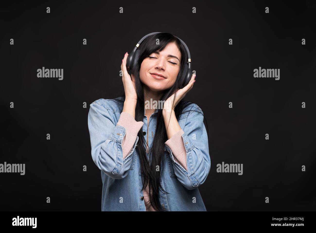 Listen music pose hi-res stock photography and images - Alamy