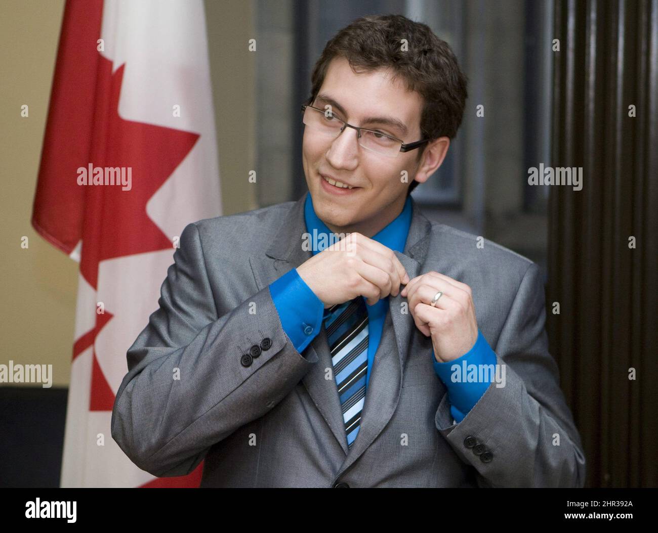 Canada's youngest Member of Parliament, Pierre-Luc Dusseault, attaches ...