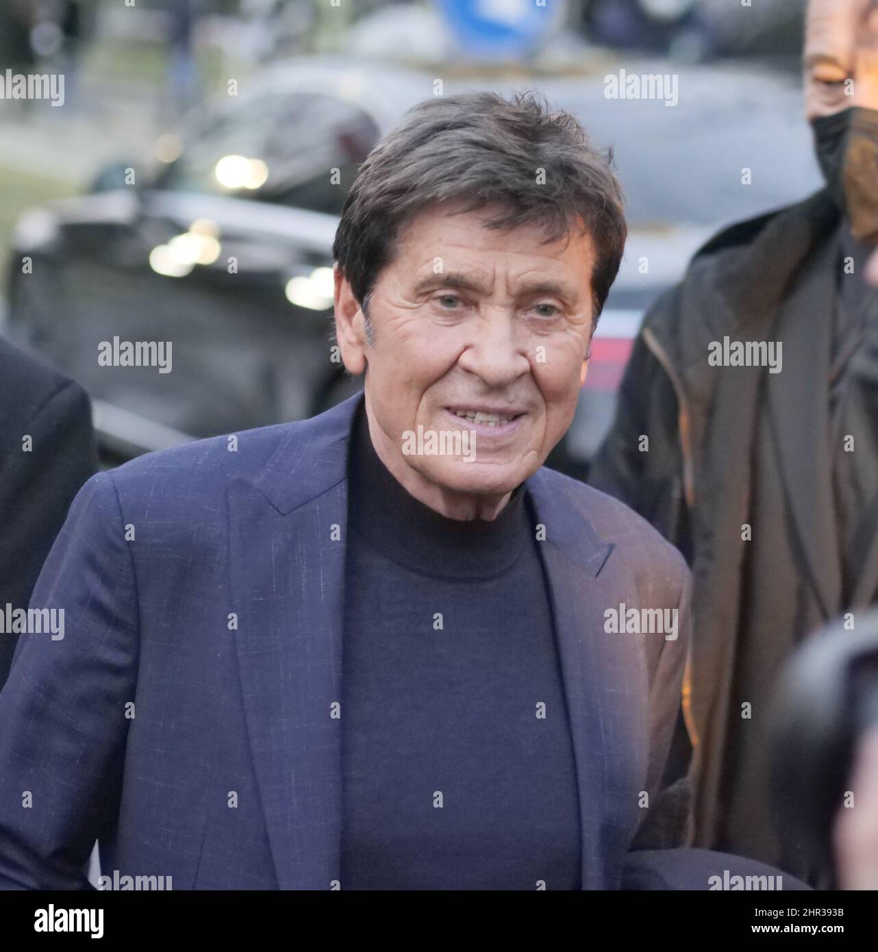 Gianni Morandi posing for photographers after Emporio Armani fashion ...