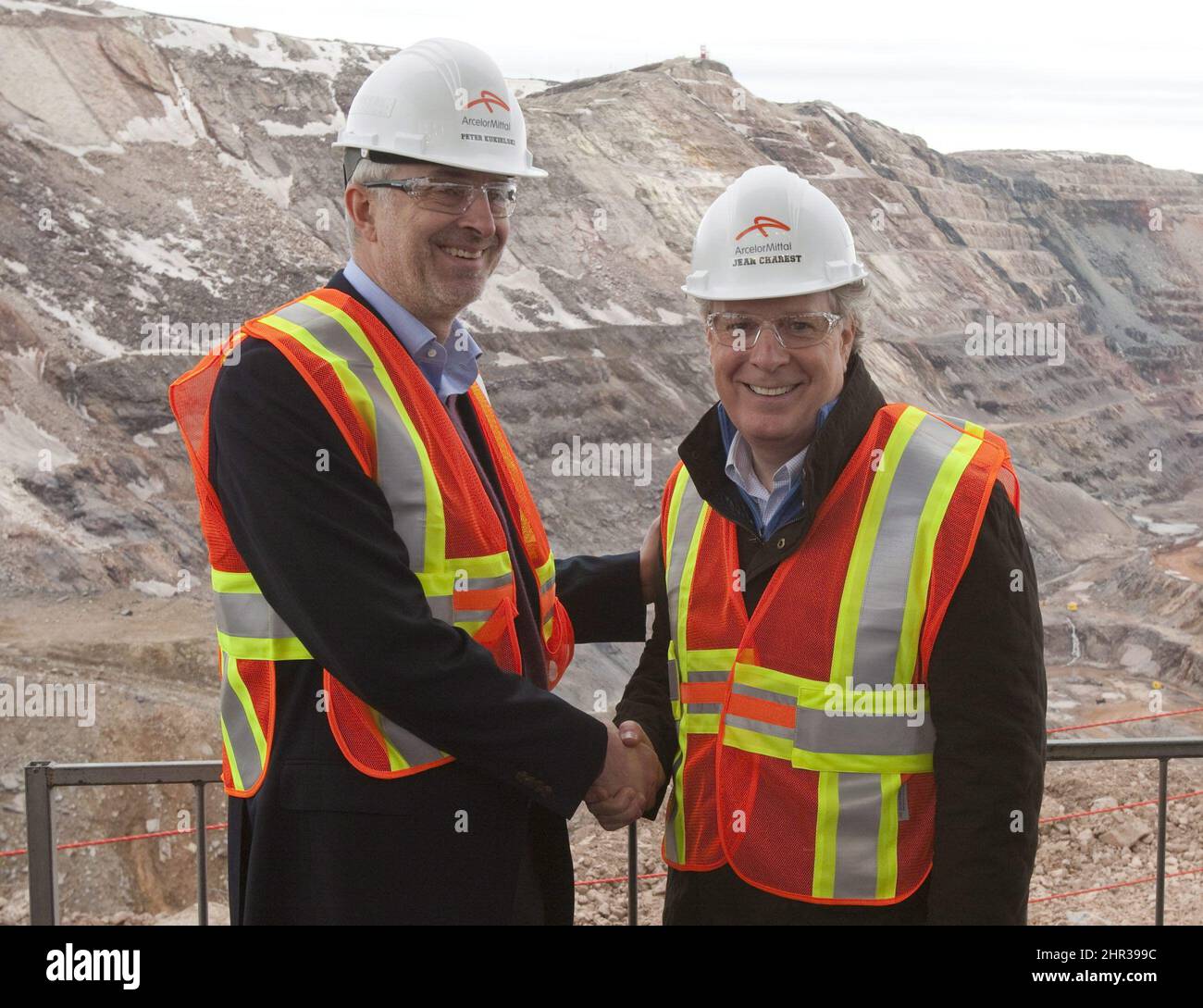 Quebec Premier Jean Charest, right, shakes hands with Peter Kukielski ...