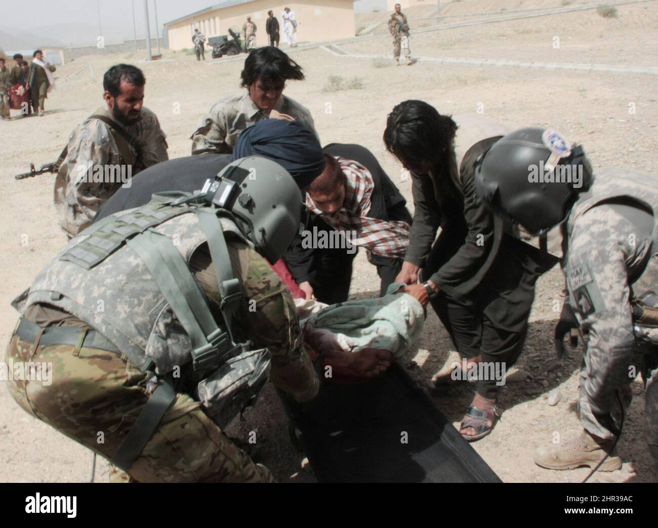U.S. medevac crew prepare to transport an Afghan civilian badly injured ...