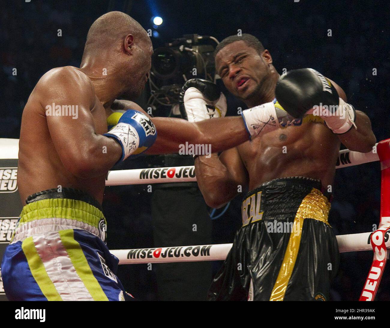 Jean Pascal, right, from Montreal, takes a left from Bernard Hopkins ...
