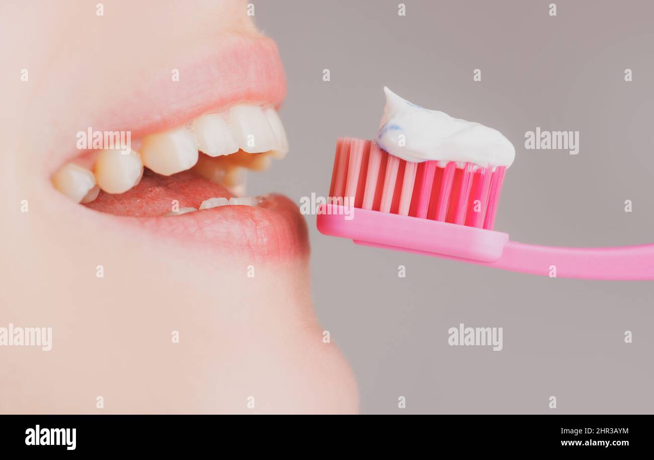 Dental Care close up. Woman brushing her teeth. Closeup on happy young ...