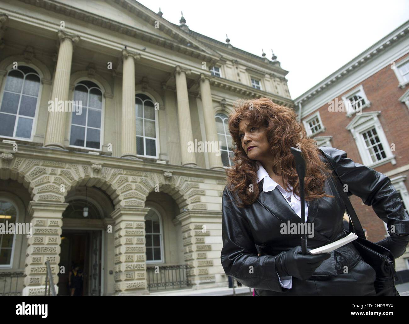 Dominatrix Terri-Jean Bedford holds a riding crop as she leaves the ...
