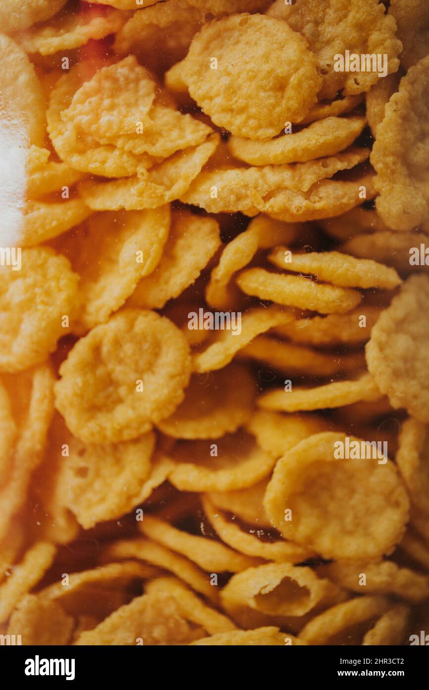 Vertical shot of sweet golden cornflakes can be used as a background ...