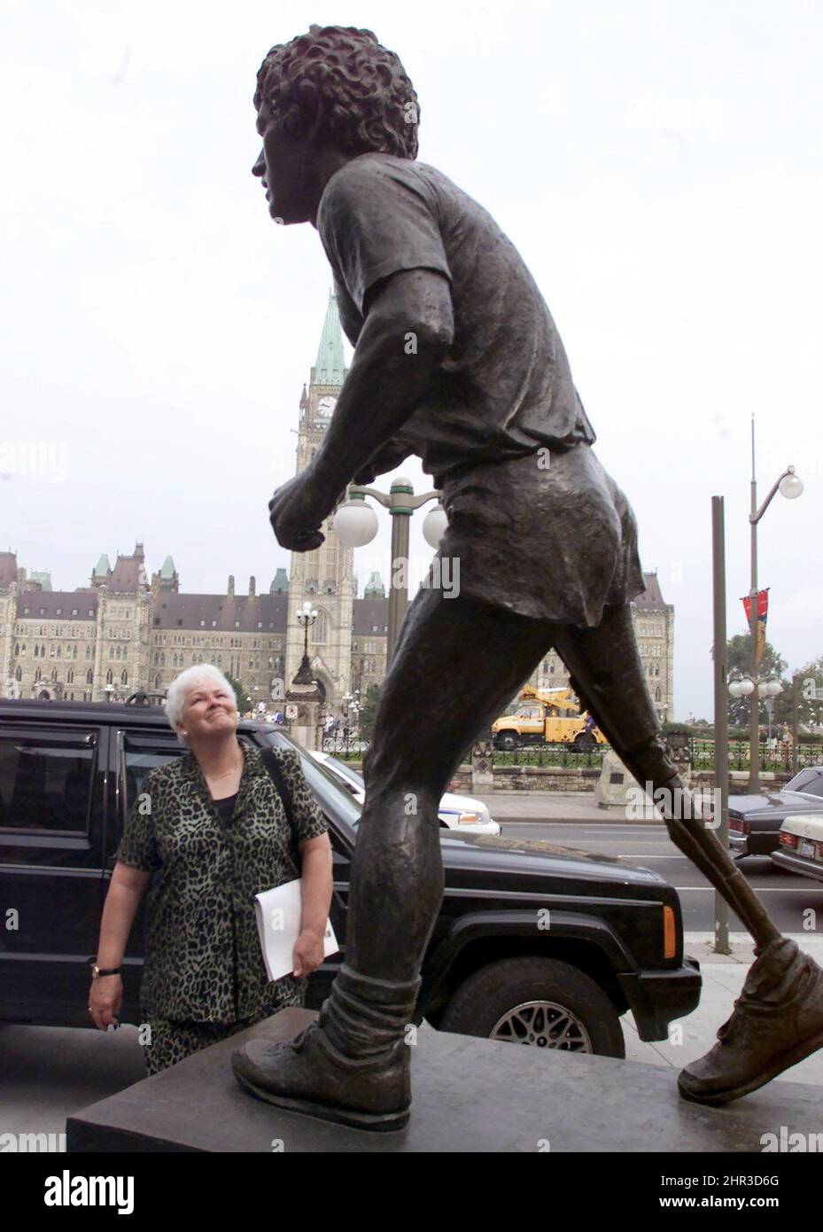 Betty Fox mother of Terry Fox stops at the statue of her son below ...