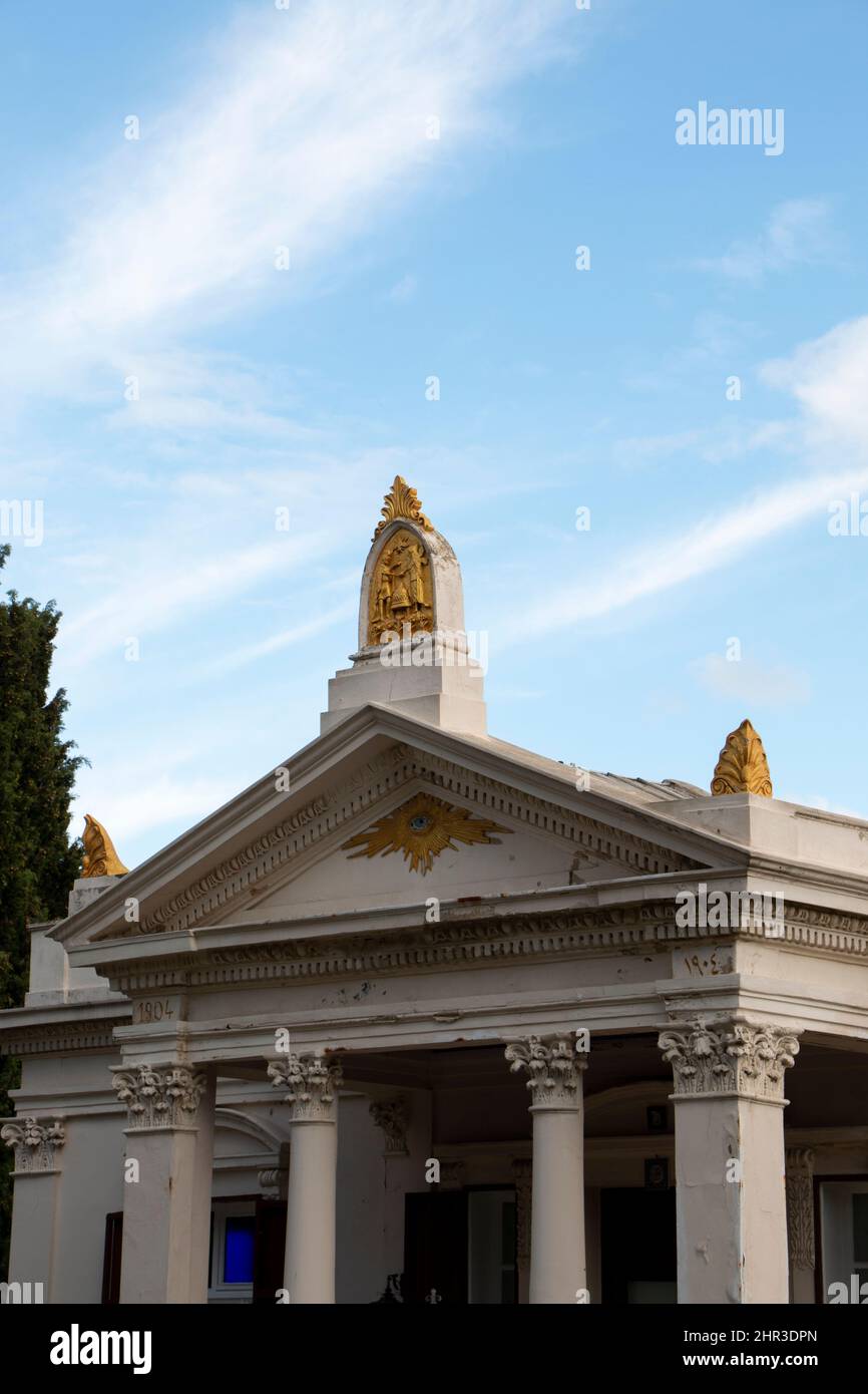 Old white church with gold motifs. church which is a landmark of city ...