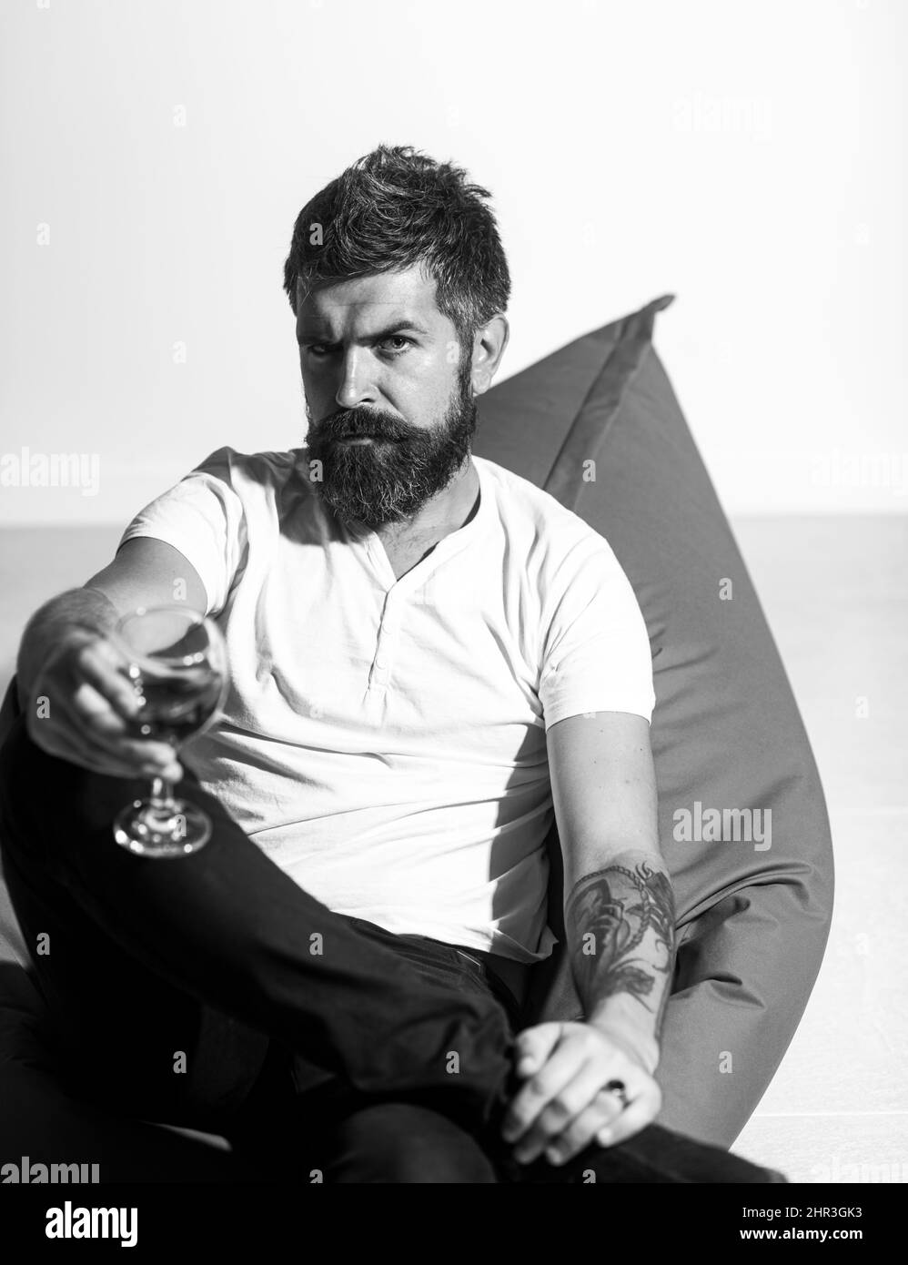 Sommelier. Man with alcohol. Drinking alcohol. Bad habits. Bearded ...