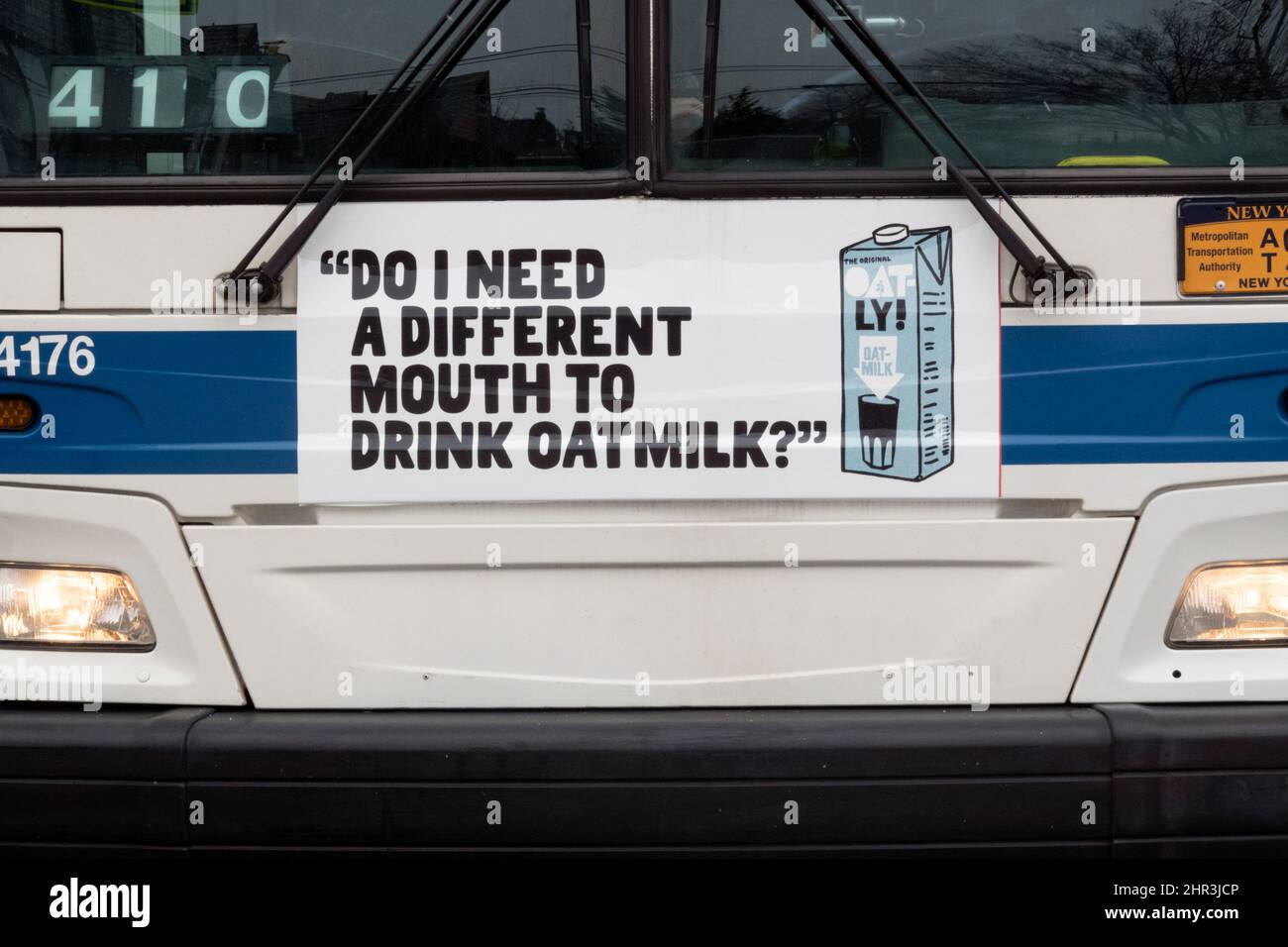 A quirky funny irreverent Oatly oat milk ad on the front of a New York ...