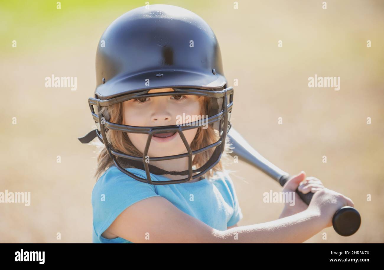 Kid baseball ready to bat. Child batter about to hit a pitch during a ...
