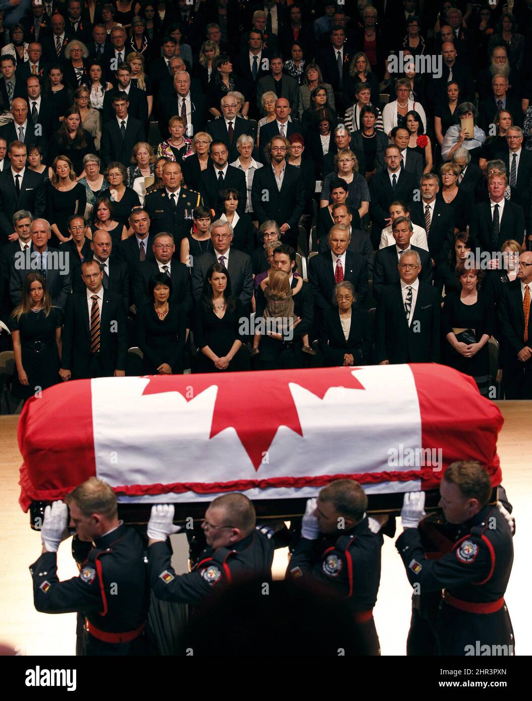 Family members and dignitaries watch as the coffin of the late NDP ...