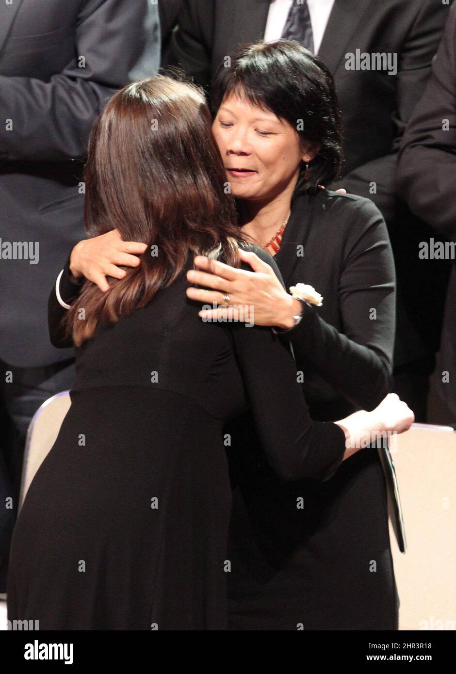 Olivia Chow hugs her stepdaughter Sarah Campbell at the state funeral ...
