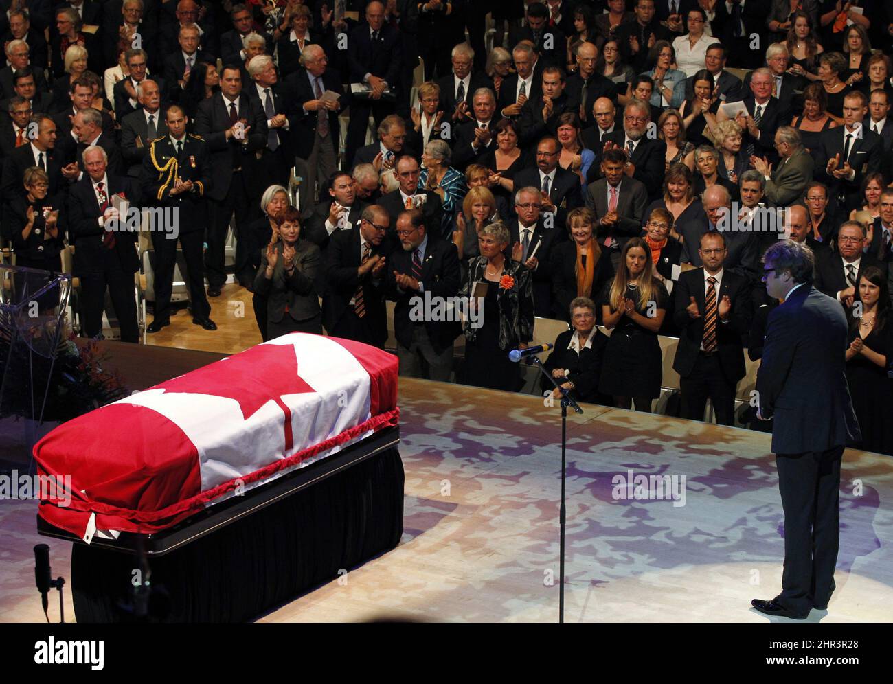 People applaud singer Stephen Page, right, after he performed at the ...