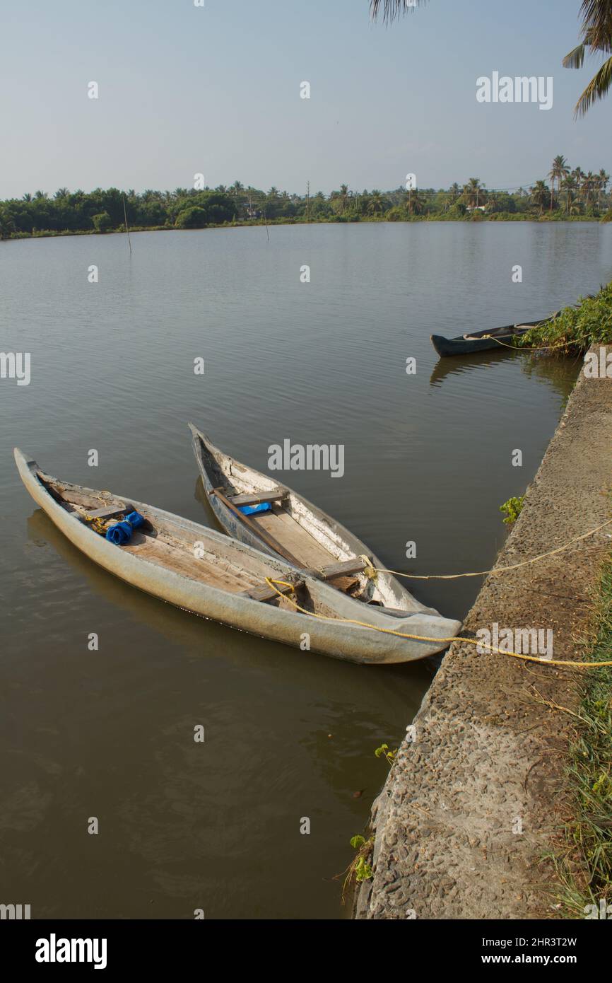 small open type fishing boats moored near lake shore Stock Photo - Alamy