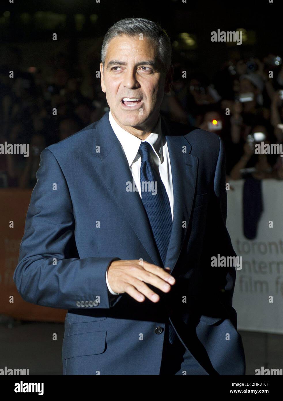 George Clooney poses on the red carpet before the screening of "The ...