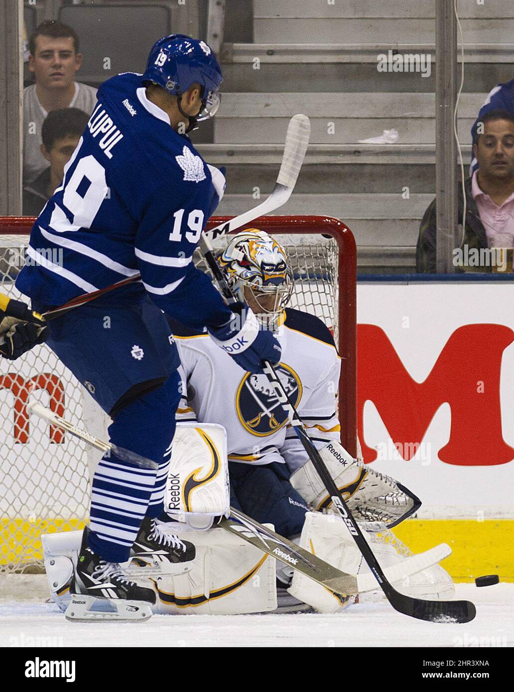 Buffalo Sabres goalie Ryan Miller, right, makes a pad save on a tip by ...