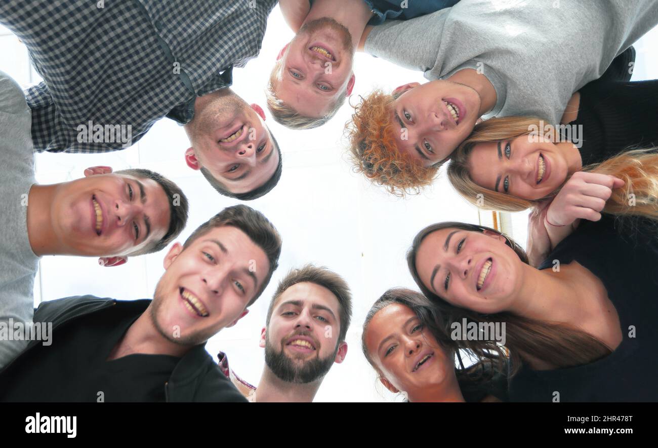 bottom view. group of diverse young people standing in a circle Stock ...