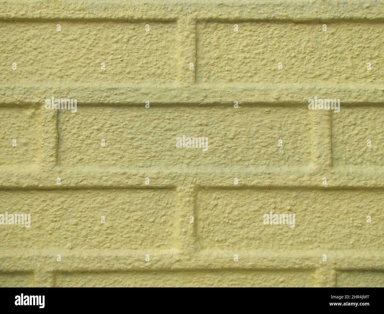 Yellow color painted brick texture background Stock Photo - Alamy