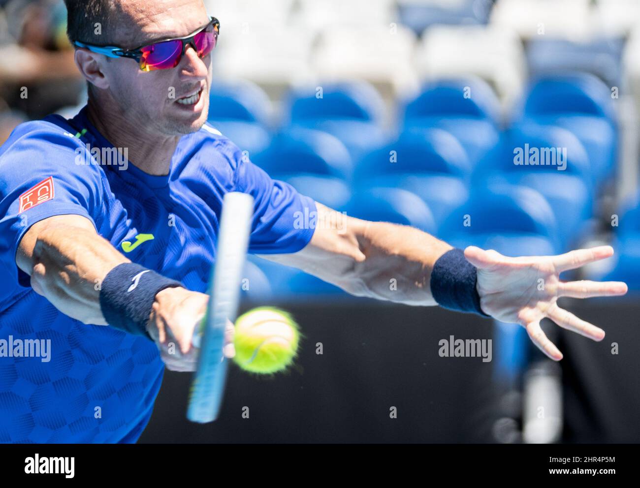 Filip Polasek hitting a volley at the Australian Open Stock Photo - Alamy