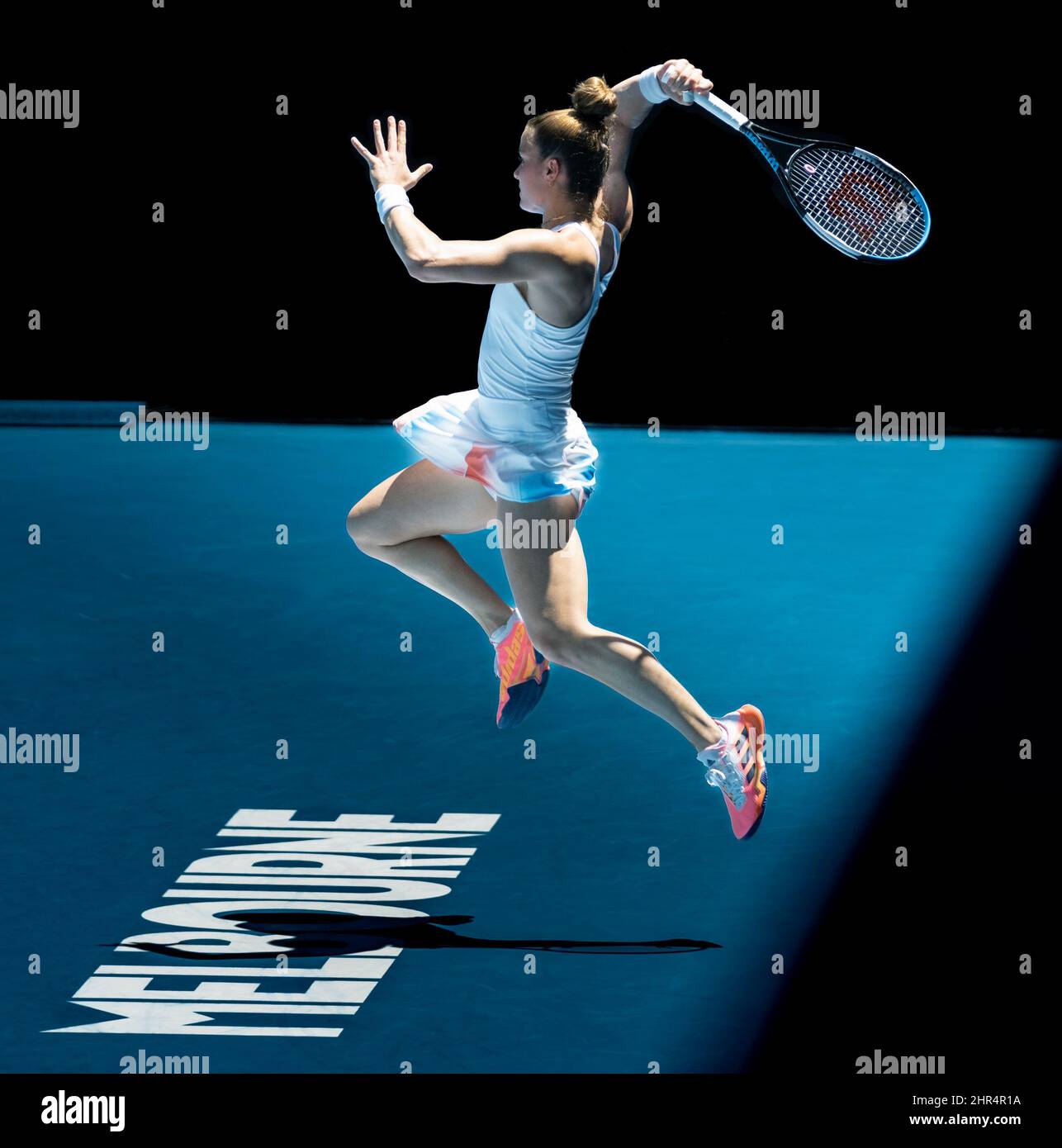 Tennis player Maria Sakkari hits a forehand as she jumps back over the ...