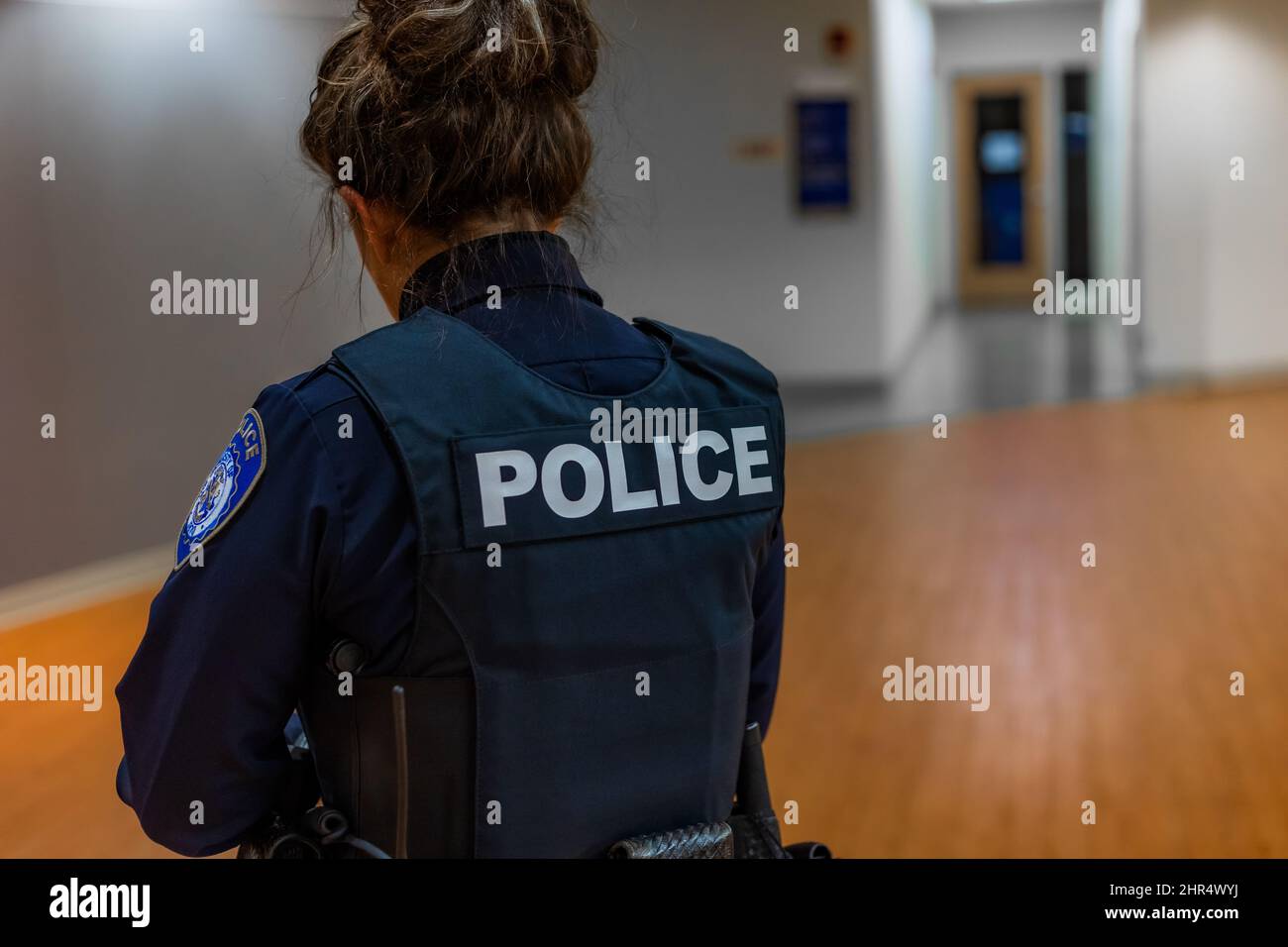 Female police officer searching for trace evicende of a crime Stock ...