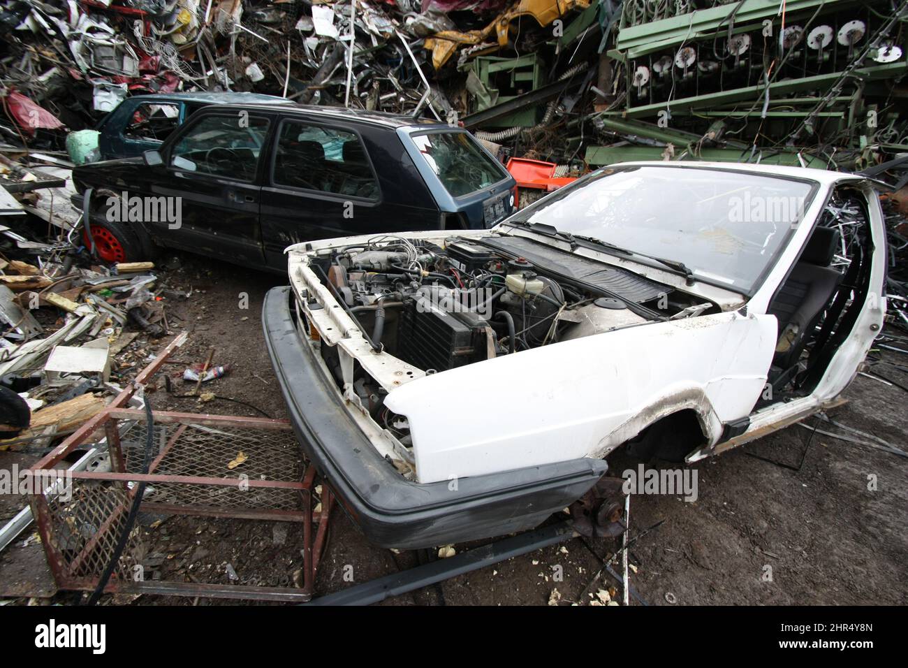 Scrap space with cars and iron pipes and garbage Stock Photo - Alamy