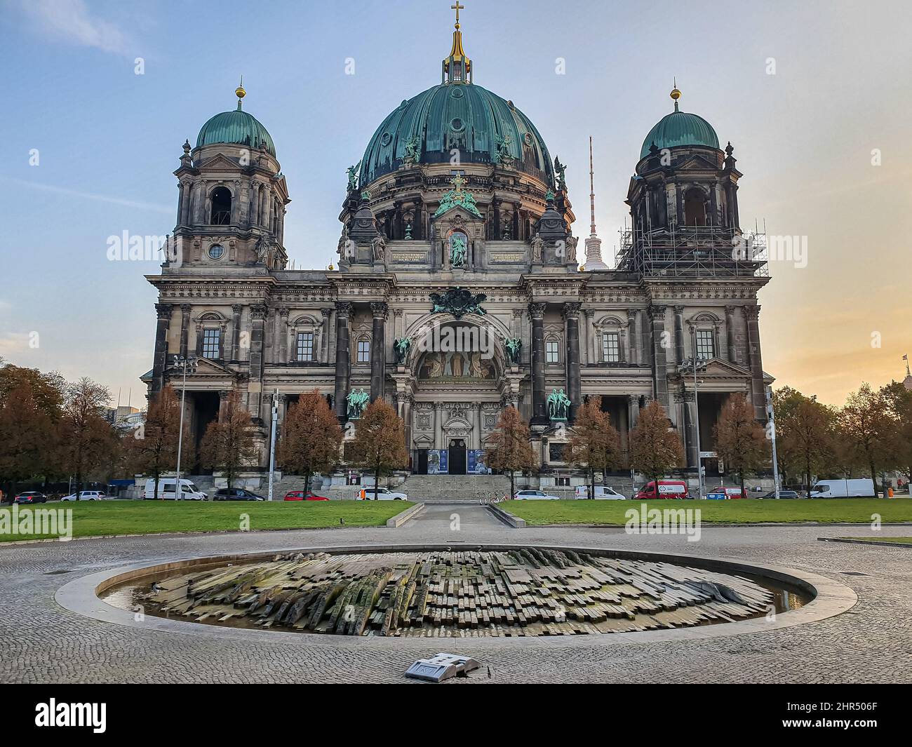 Exterior of Berlin Cathedral with engravings and domes and a fountain ...