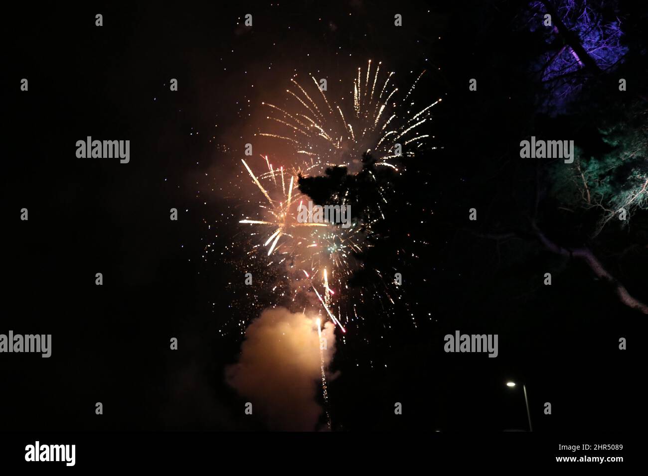 Low angle shot of bright fireworks during an event at night - perfect ...