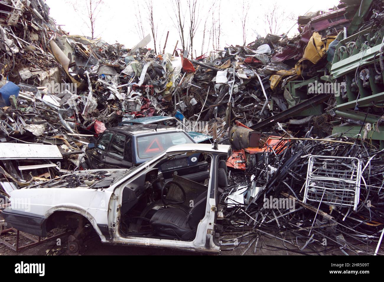 Scrap space with cars and iron pipes and garbage Stock Photo - Alamy