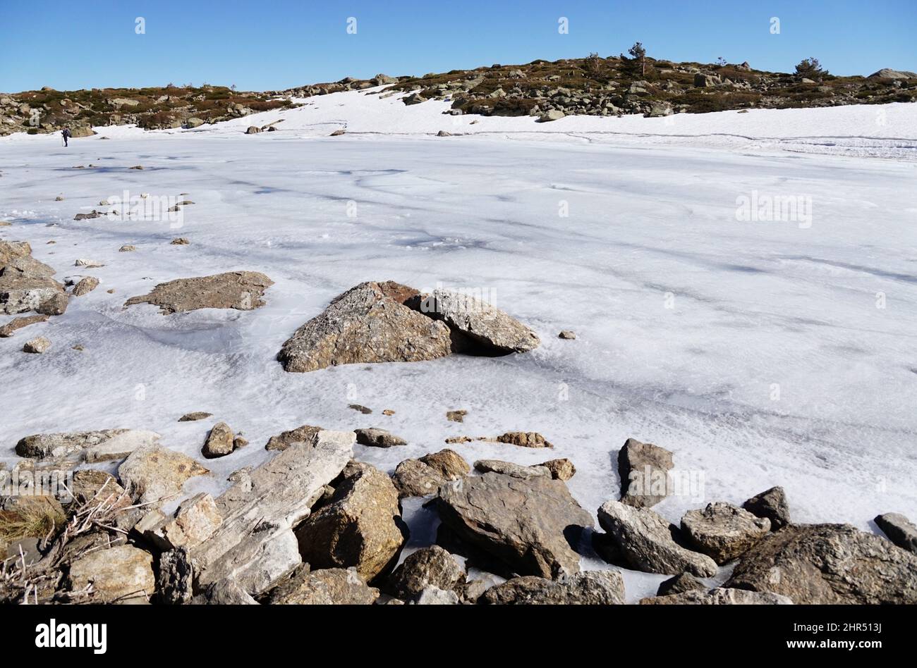 Landscape of rocks covered in the snow on a sunny day in Navacerrada ...