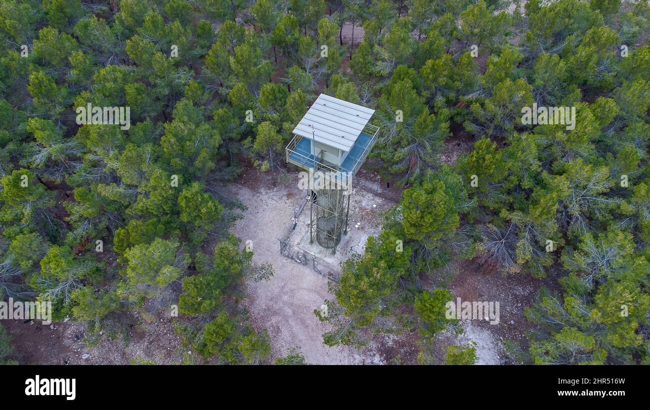 Aerial view of a beautiful landscape with trees, watchtower greenery ...