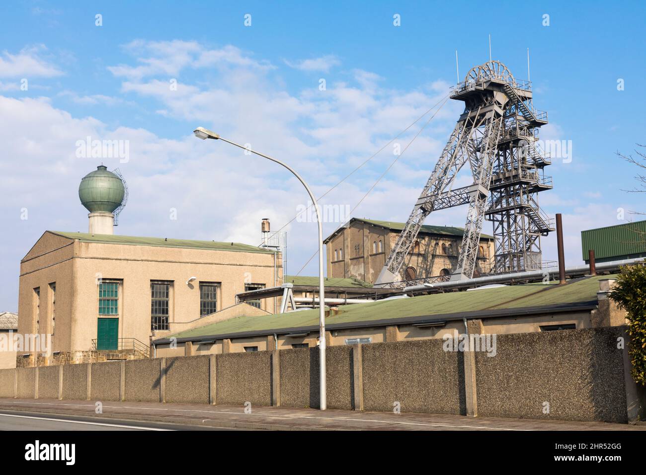 Mining building near a conveyor scaffolding against a blue sky Stock ...