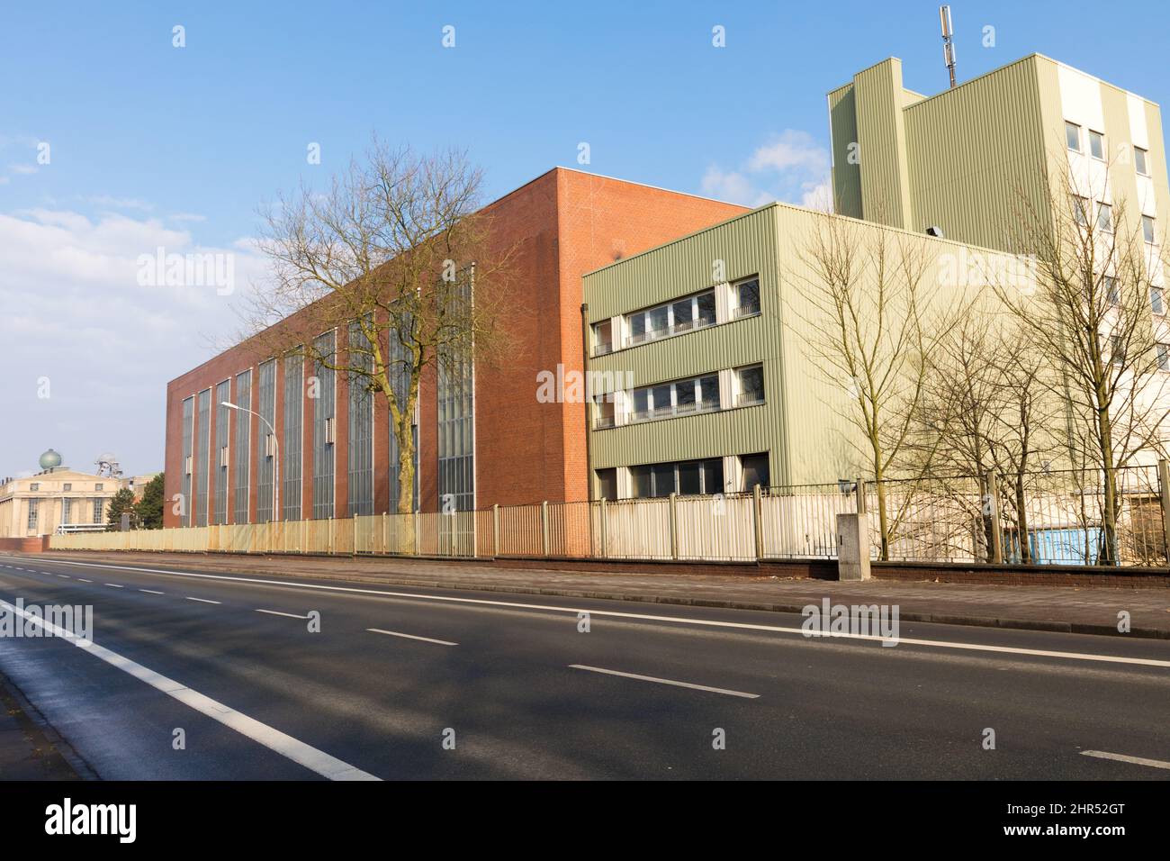 Mining building along an empty highway under a cloudy sky Stock Photo - Alamy