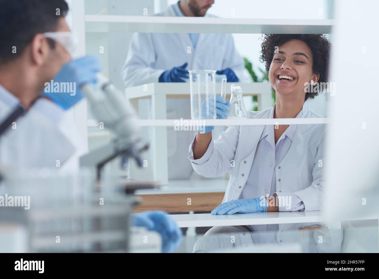 Smiling scientists looking at camera arms crossed in laboratory Stock ...