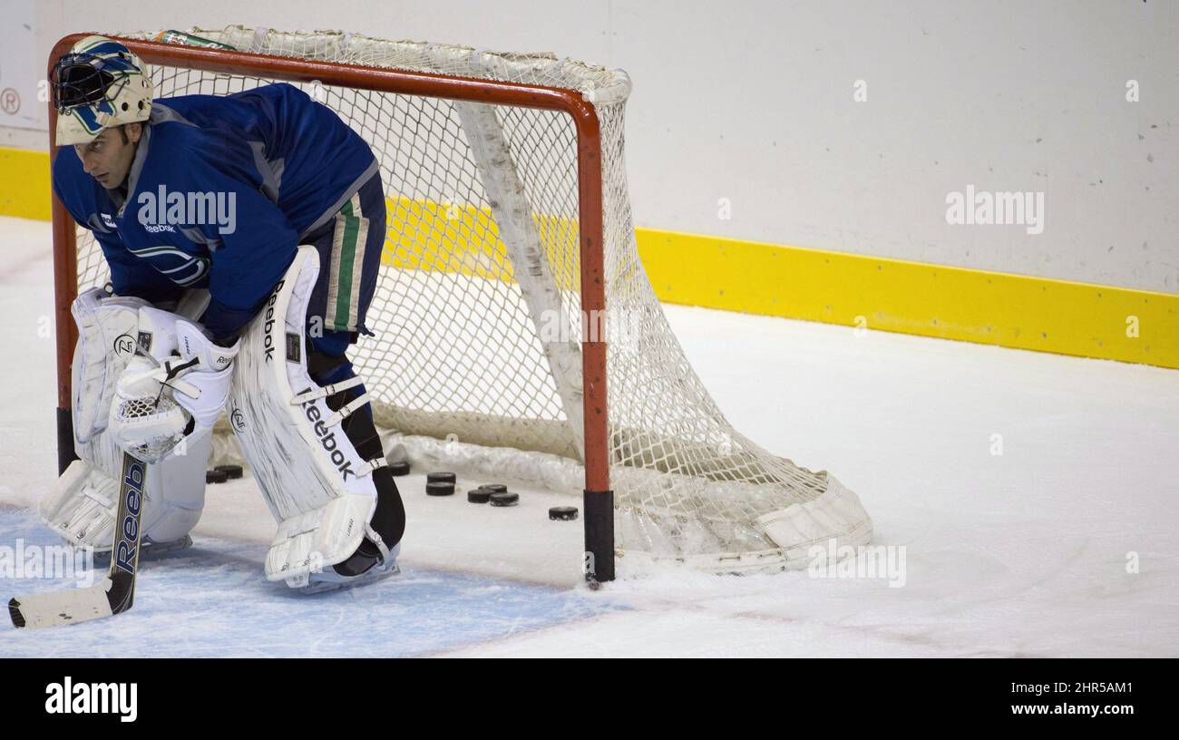 Vancouver Canucks goaltender Roberto Luongo pauses for a moment during ...